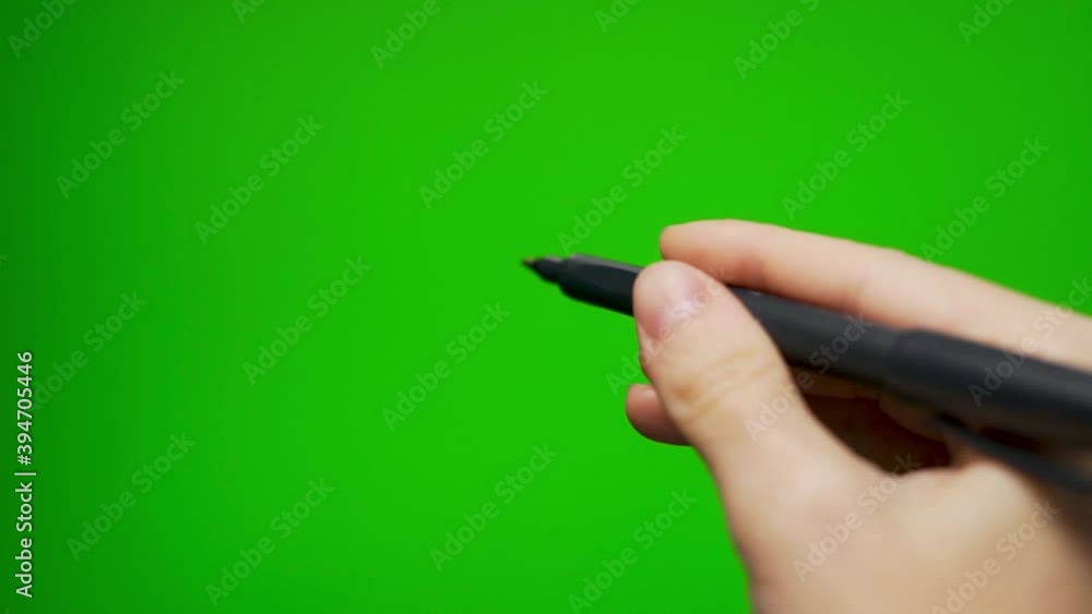 The Woman Draws with a Pen on a Green Background, Green Screen, Chroma ...