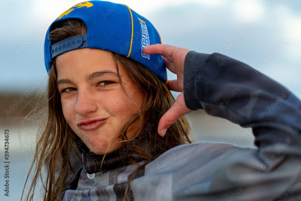 Tween with attitude and baseball cap on backwards Stock Photo | Adobe Stock