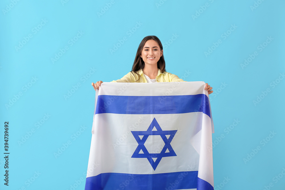 Young woman with the flag of Israel on color background Stock Photo ...