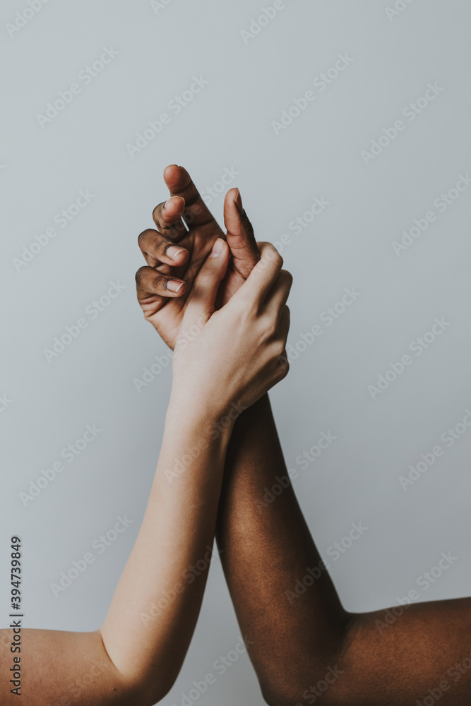 Two girls from different ethnicities posing in studio for a "body ...
