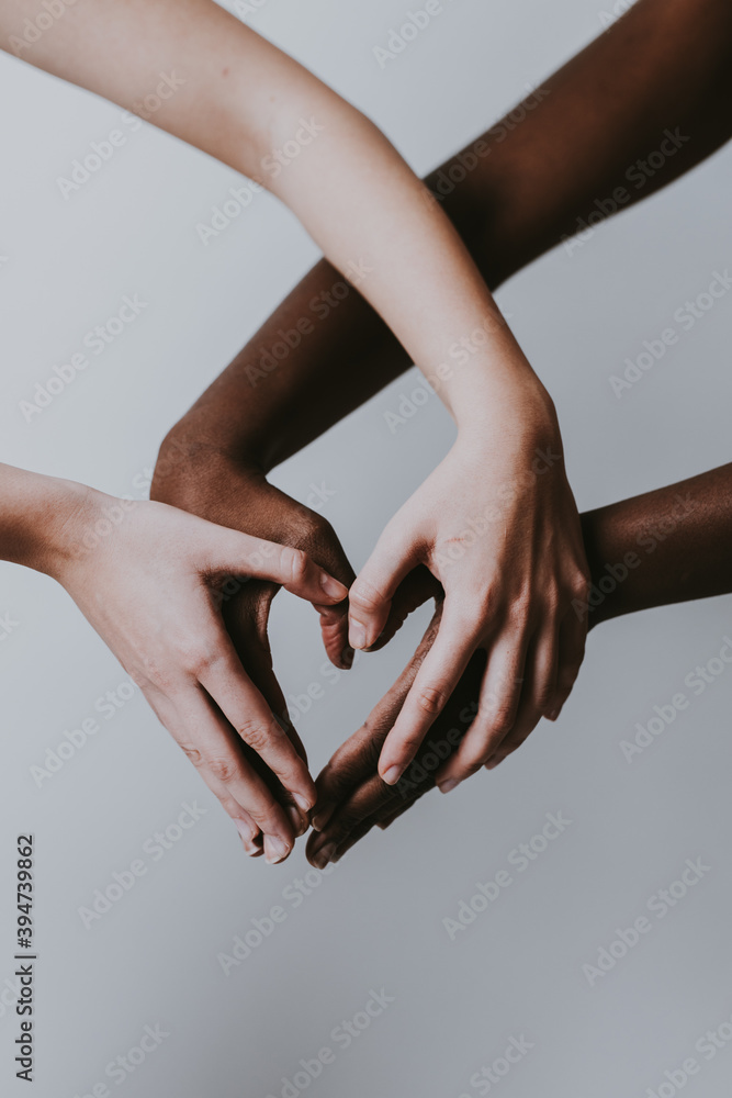 Two girls from different ethnicities posing in studio for a "body ...