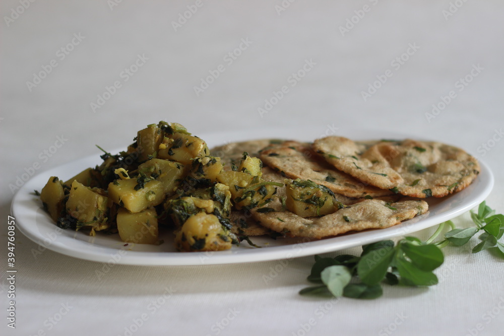 Fenugreek pooris and roast potatoes with fenugreek leaves Stock Photo ...