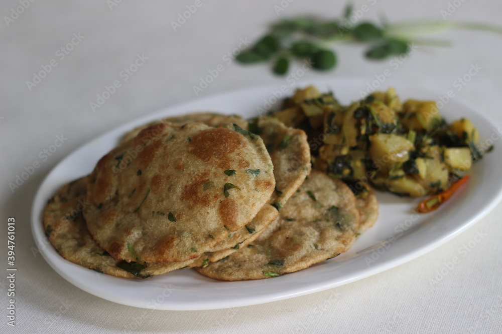 Fenugreek pooris and roast potatoes with fenugreek leaves Stock Photo ...