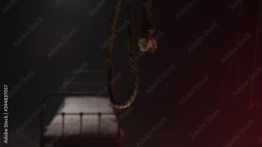 scary noose gallows for execution swings in dark against background of ...