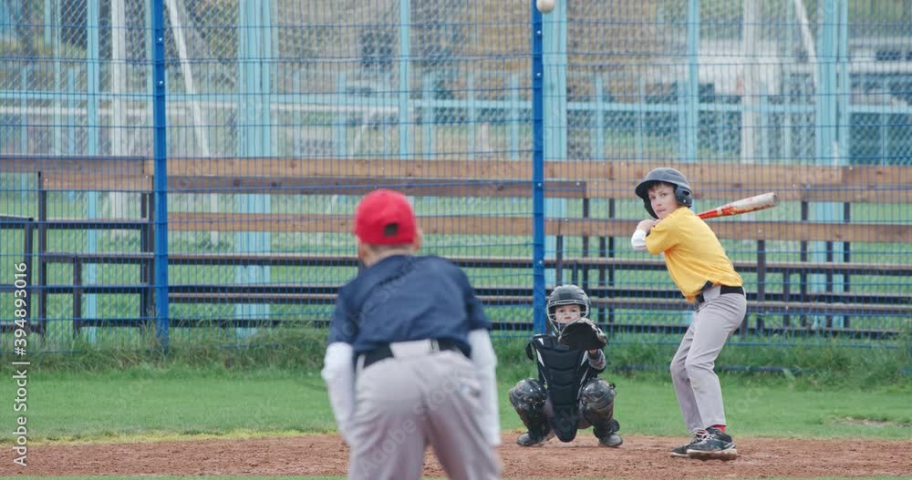 Baseball tournament at school, boys play baseball, the pitcher throws ...