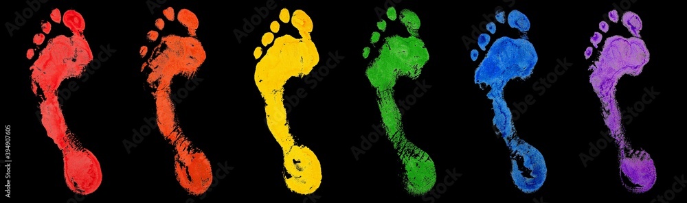 Footprints set LGBTQ community rainbow flag color black background ...
