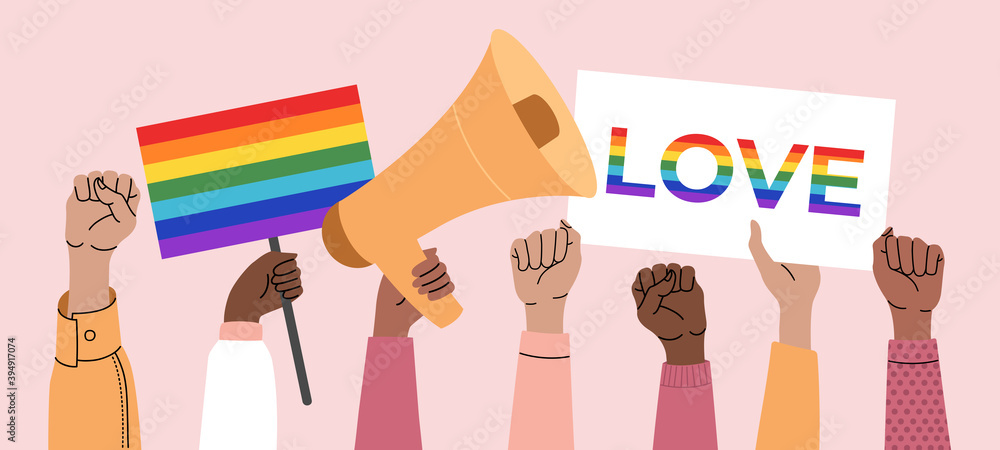 A crowd of people holding posters, transgender, lgbt and flags at a gay ...