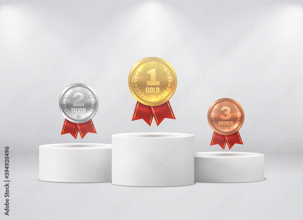 Medals on pedestal. First, second, third place on podium under ...