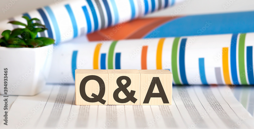 Word Q and A made with wood building blocks on chart background Stock ...