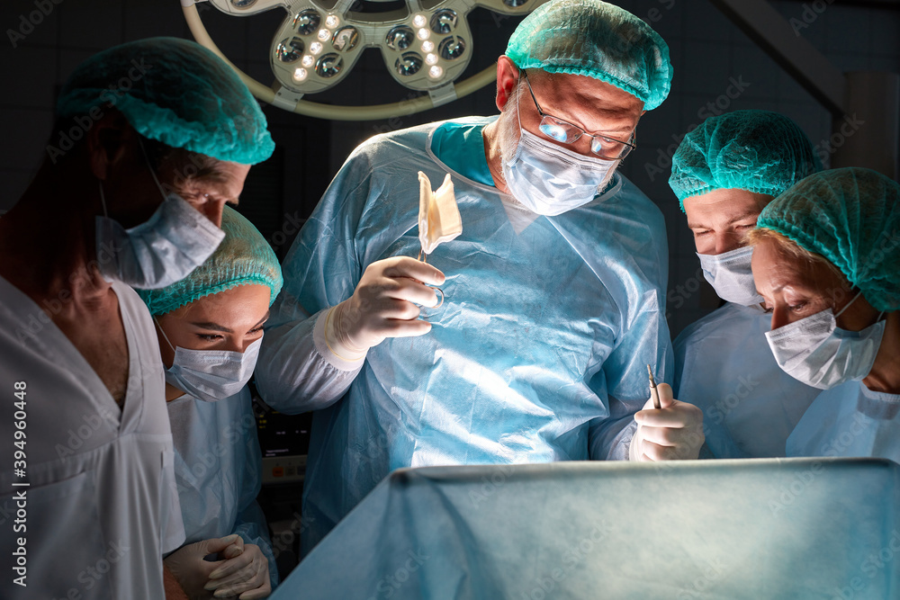 team of professional surgeons and nurses working together, group of ...