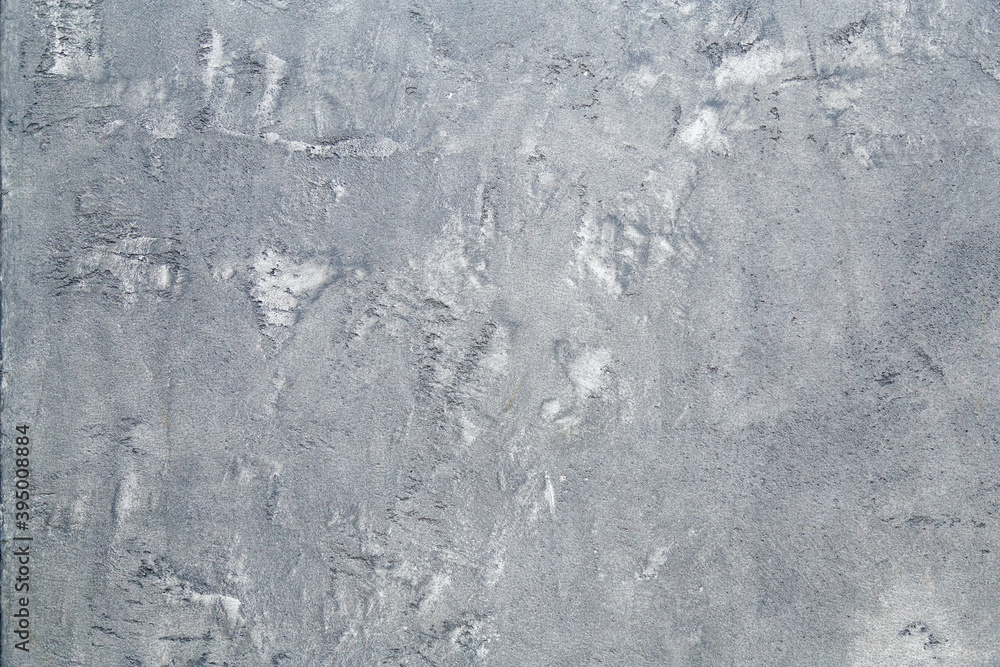Decorative plaster of grey color with textured smear, wall surface ...