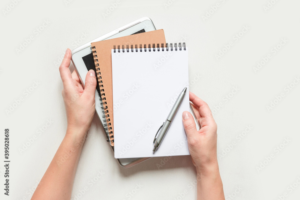 Top view of a flat lay of desktop and notepads for writing down goals ...