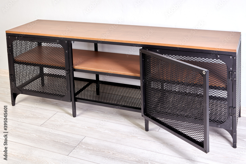 Assembled modern TV stand with black metal doors and steel frame ...