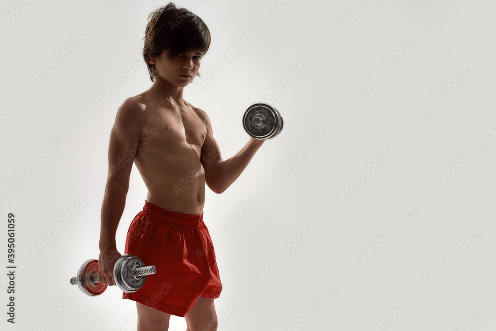 Little sportive boy child with muscular body looking at camera, showing ...