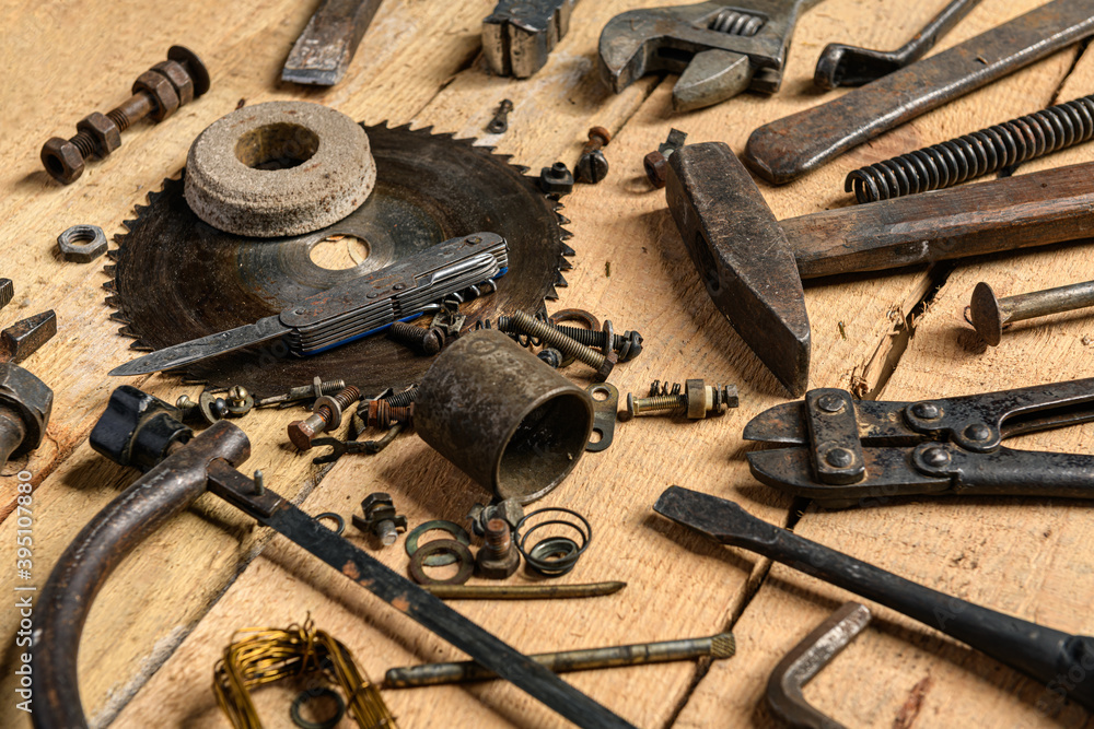 Variety of old vintage household hand tools still life on a wooden ...