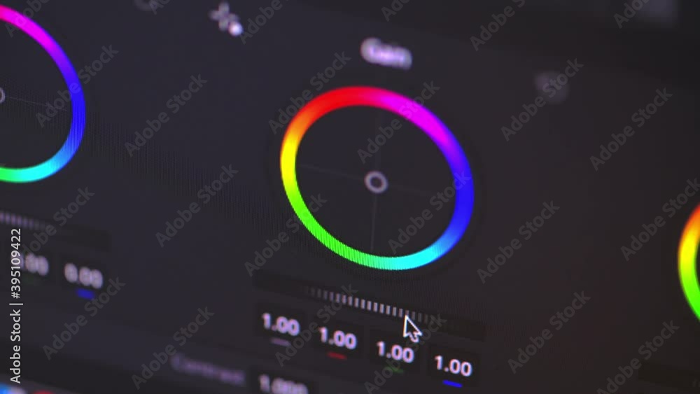 Detail of PC monitor with video editing color gradient. The mouse moves ...