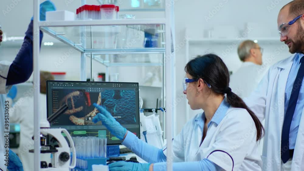 Research scientists working on pc with medical equipment analyzing ...