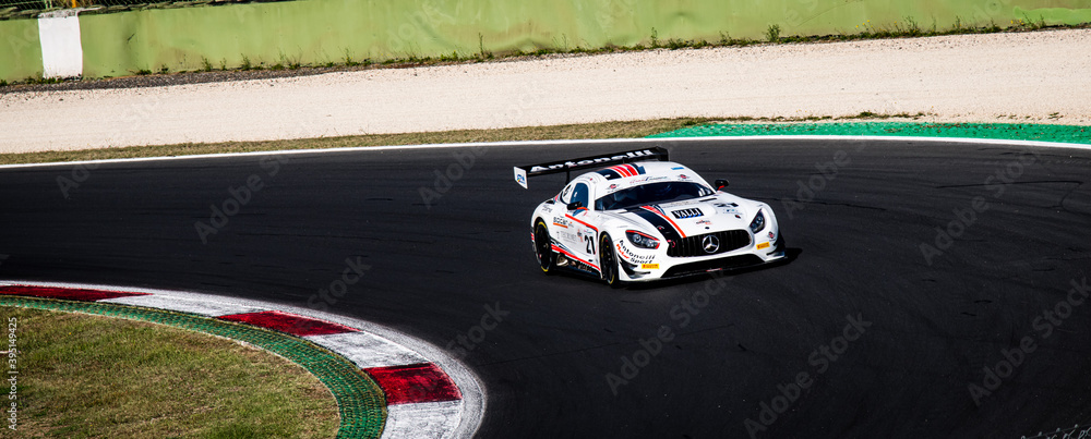 Mercedes racing car AMG GT3 model in action on asphalt turn track ...