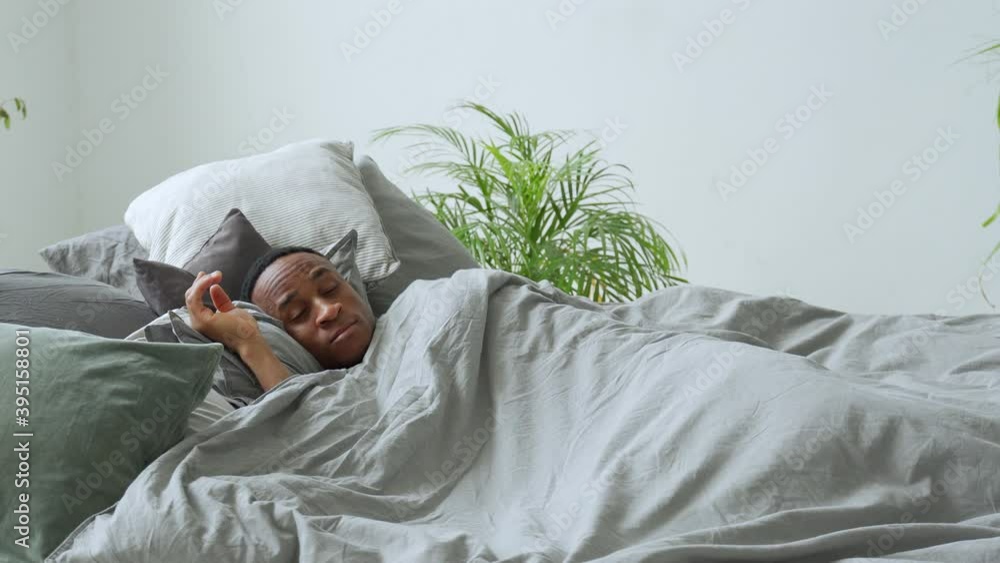 Young black man person waking up at bedroom. Happy african guy ...