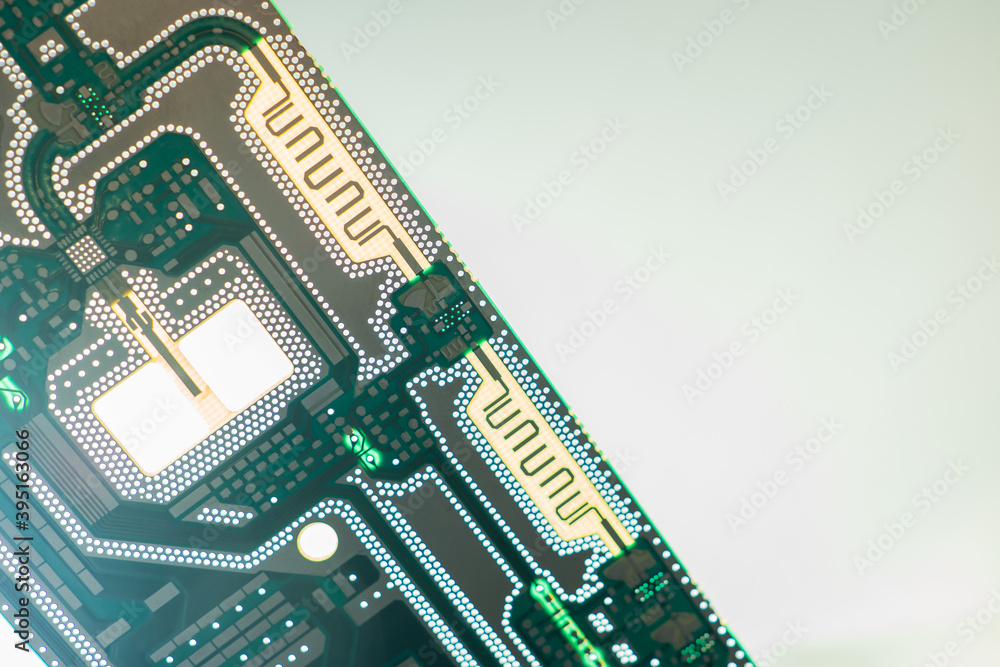 Printed circuit Board on a light background. Gray-green electronic ...