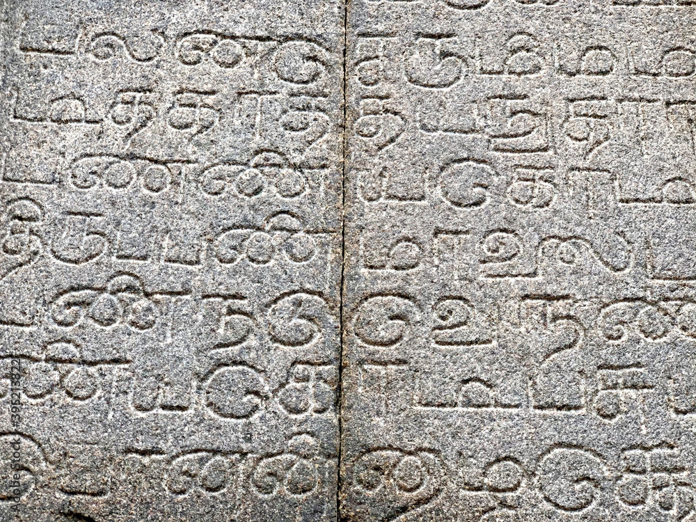 Inscriptions on the ancient temple stone walls. Ancient stone carving ...