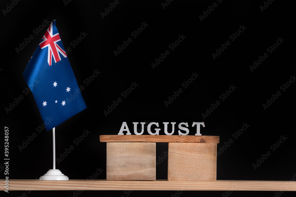 Wooden calendar of August with Australian flag on black background ...