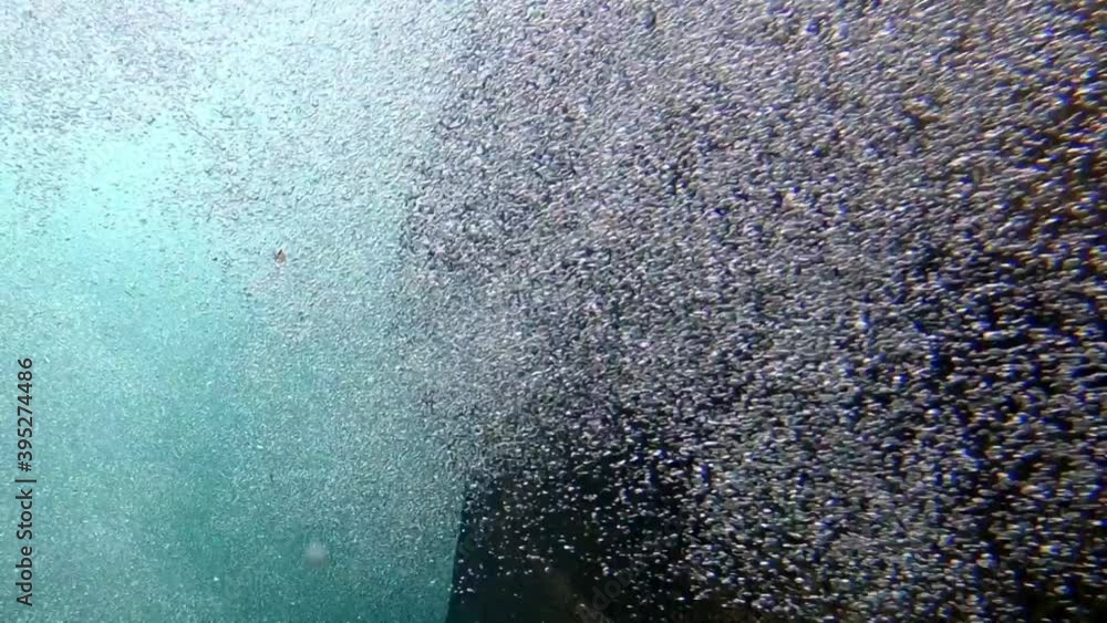 Stockvideo Water churned boils and bubbles underwater of fast flowing ...
