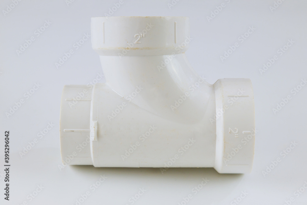 White polypropylene PVC polymer female pipe connector on a white ...