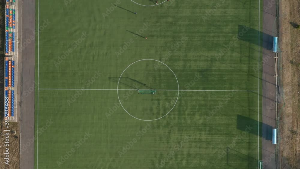 Flying over the football field. Playing football in the stadium Stock ...