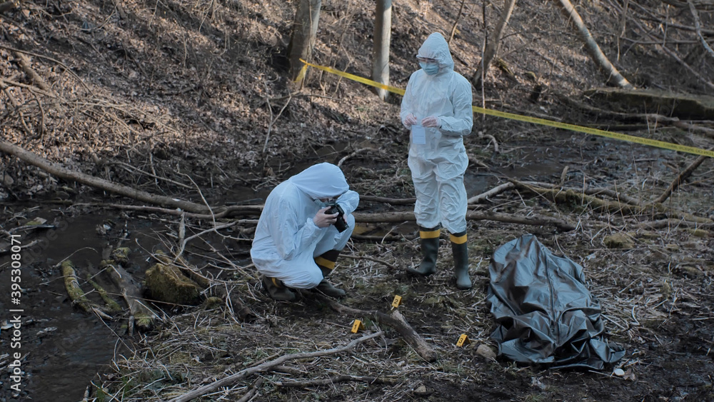 Detectives are collecting evidence in a crime scene. Forensic ...