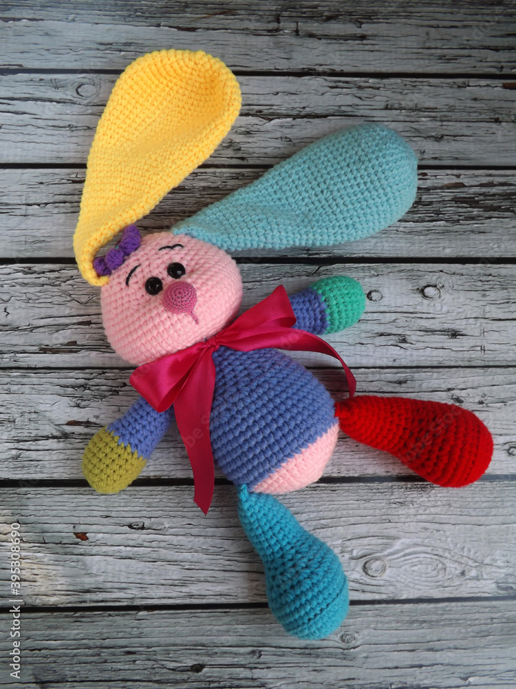 Colorful bunny doll with flappy ears which made by crocheting yarn. It ...