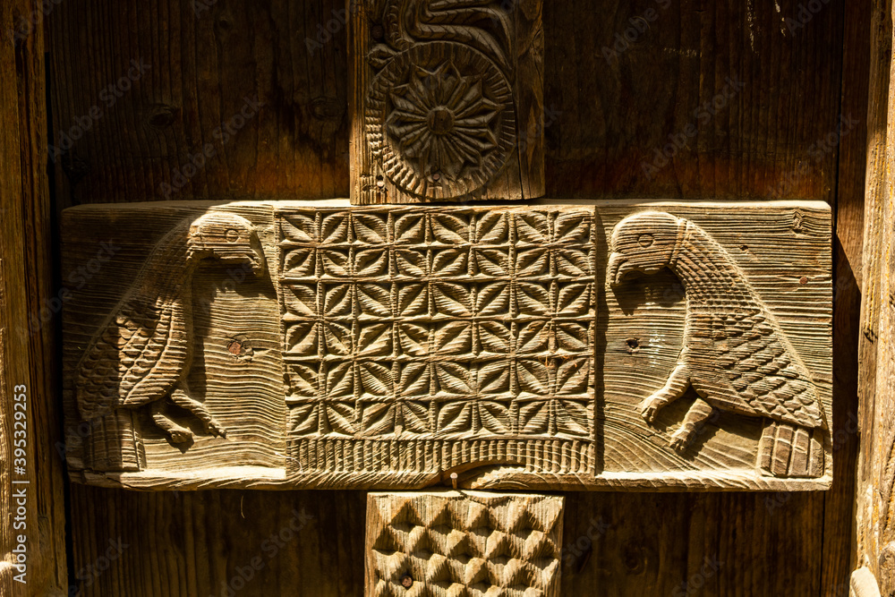 Ornate carvings on the wooden door of an ancient temple Stock Photo ...