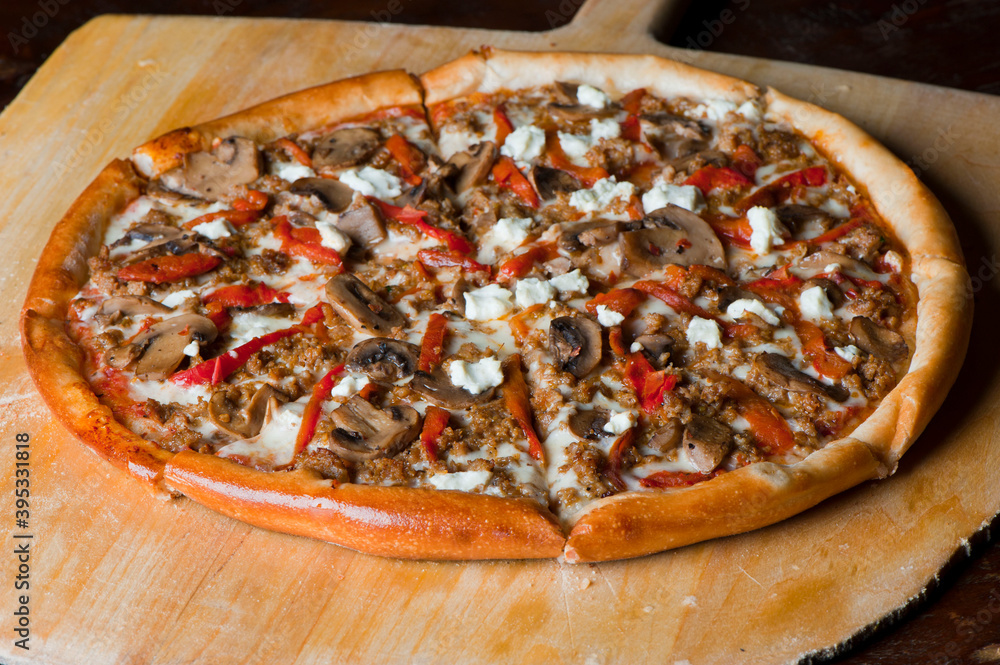 Pizza. Hand rolled pizza dough, topped with homemade tomato sauce ...