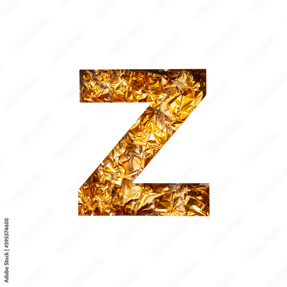 Gold letter Z of English alphabet of shiny foil and paper cut isolated ...