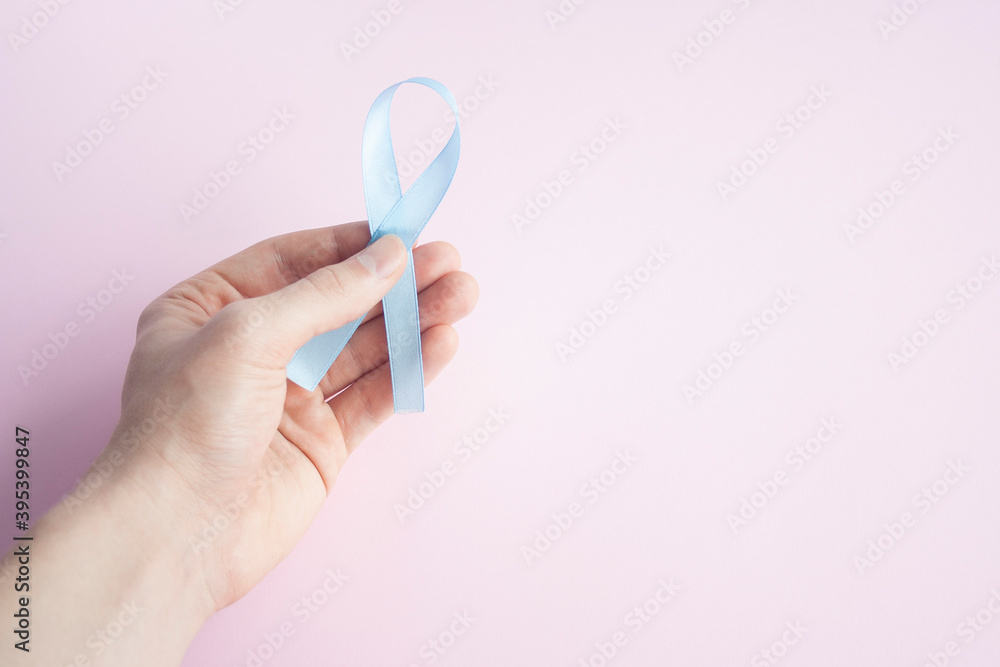 November Prostate Cancer Awareness month, Man Hand holding Blue Ribbon ...