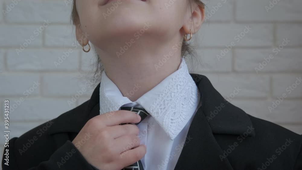 Child wear business clothes. A view of a little girl in oversize ...