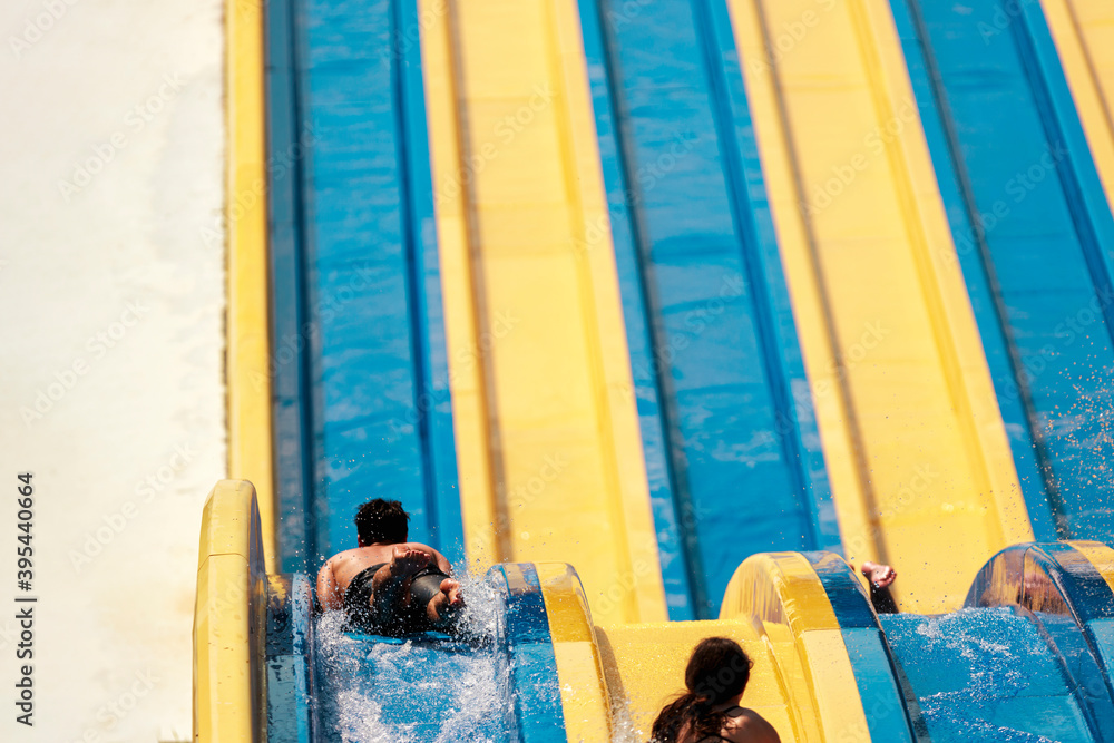 Water park adventure aqua park with cool people having fun on the water ...