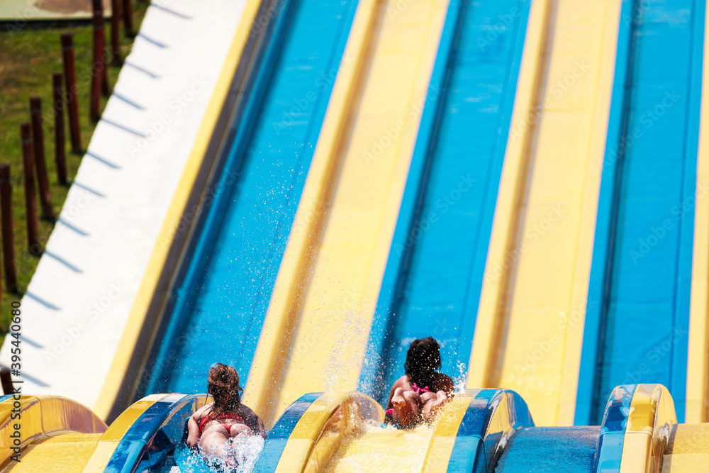 Water park adventure aqua park with cool people having fun on the water ...