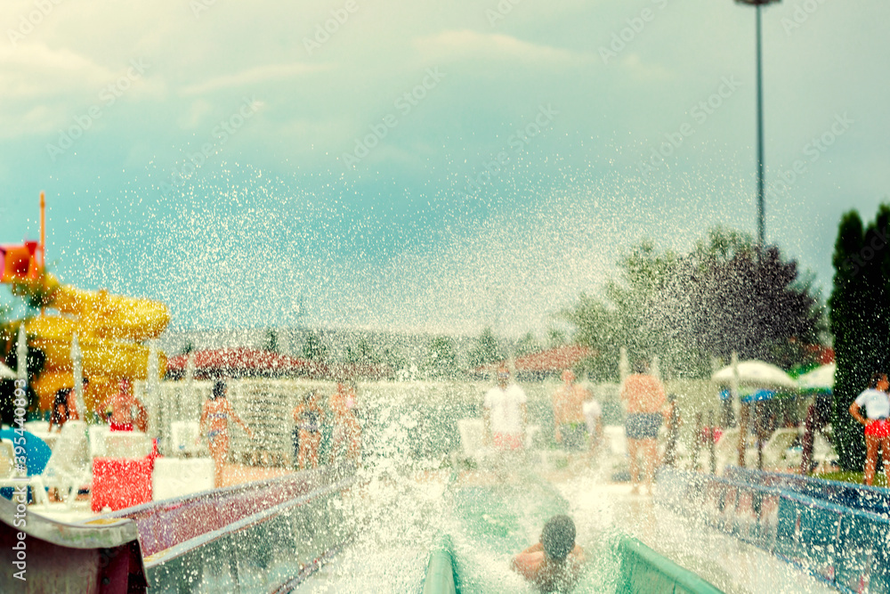 Water park adventure aqua park with cool people having fun on the water ...