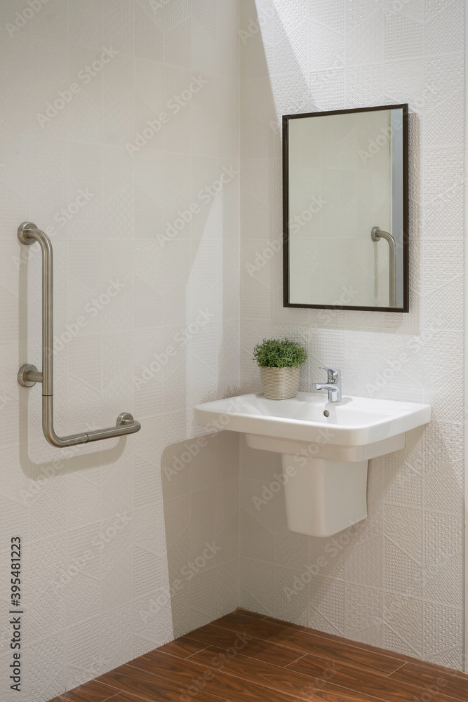 Public disabled toilet in a large building. Modern restroom for ...