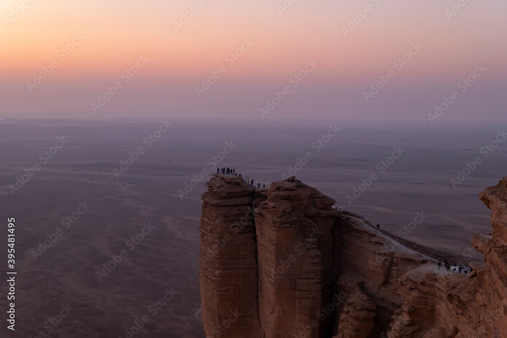 Tourists gather at Edge of the World escarpment near Riyadh, Saudi ...