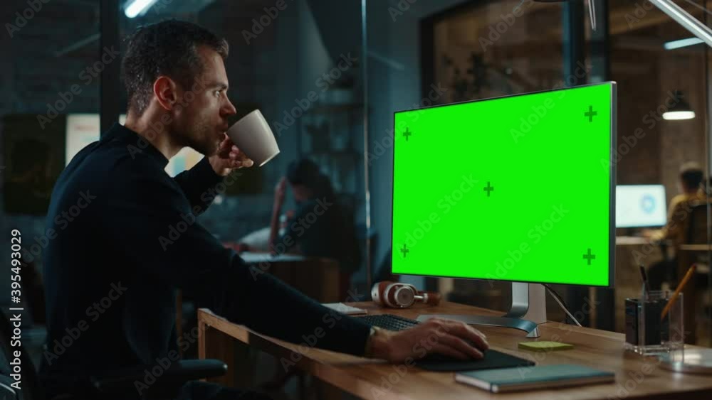 Young Handsome Specialist Working on Desktop Computer with Green Screen ...