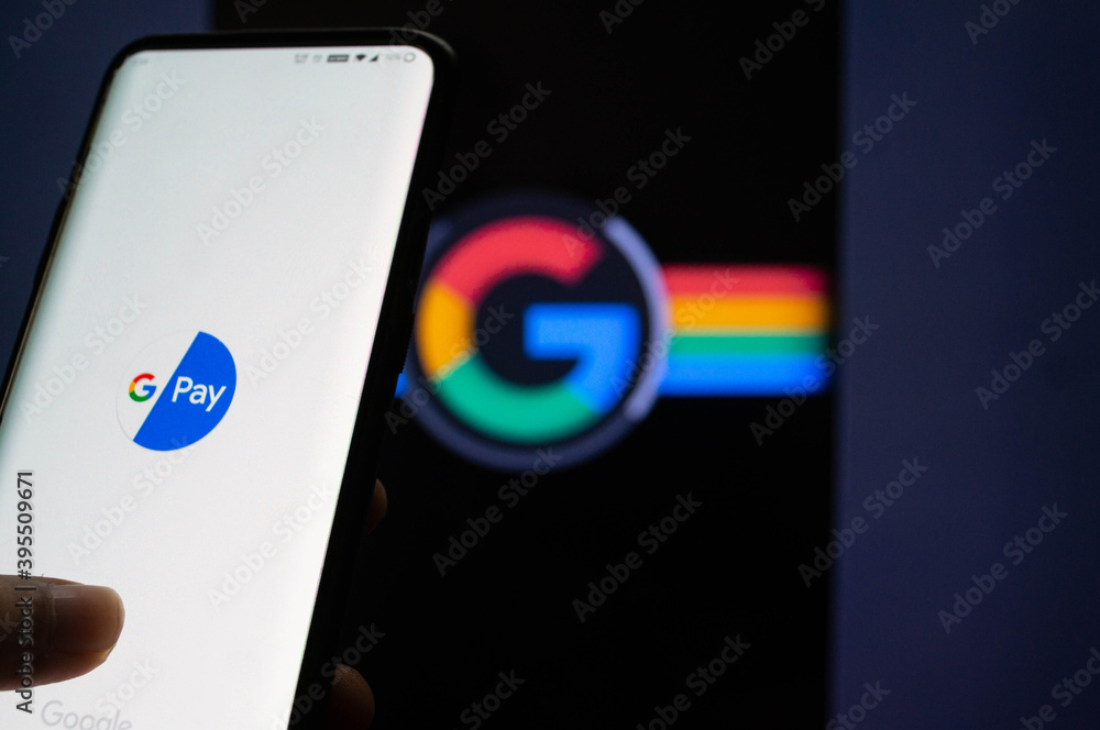 Google Pay app logged in on a mobile infront of a black screen with Google symbol Stock Photo ...