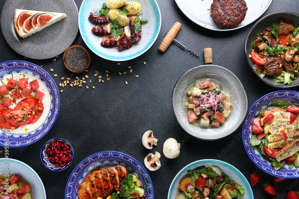 table full of food top view. Set of dishes on the table. meat salad and ...