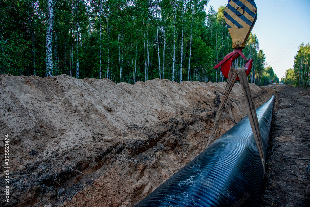 Crude oil and Natural gas pipeline construction work in forest area ...