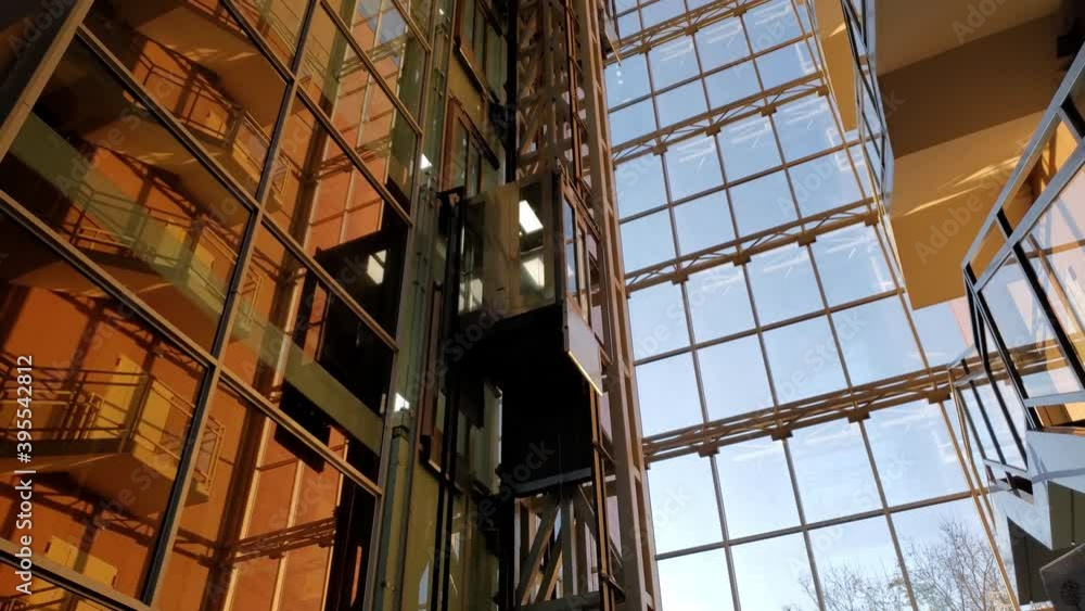 Corporate building window wall with abstract geometric reflections and ...