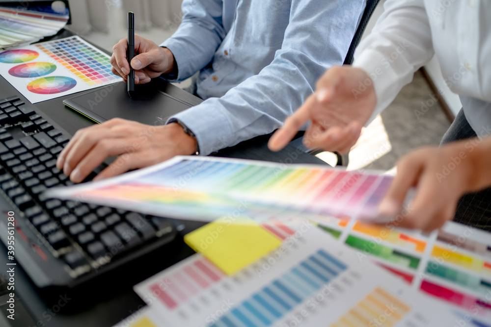 Creative graphic designer team working with colour swatch sample ...