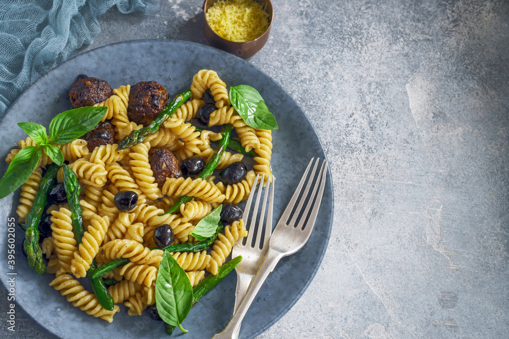 Rotini pasta with meatballs, asparagus and olives Stock Photo | Adobe Stock