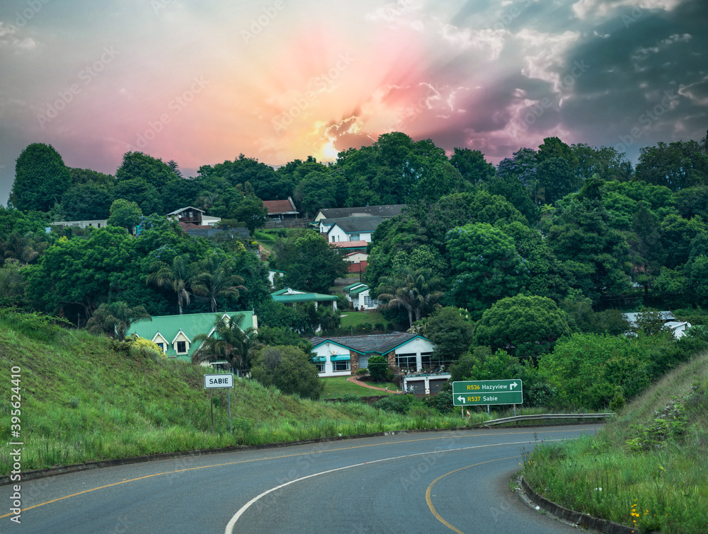 Sabie town a little village in mpumalanga South Africa with sun behind ...