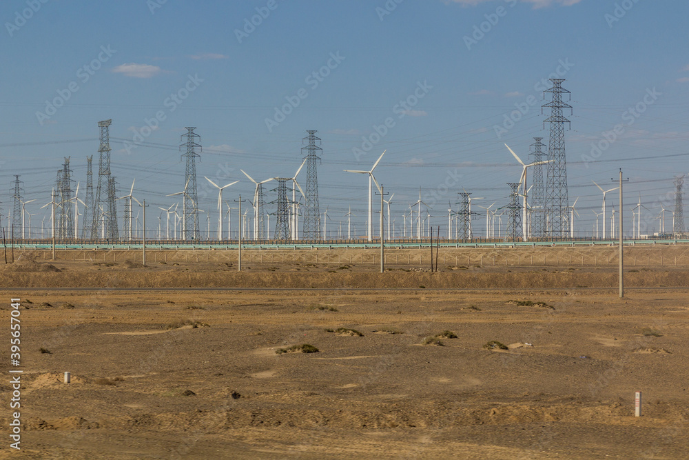 Wind power plants and electric pylons in the Gobi desert, Gansu ...